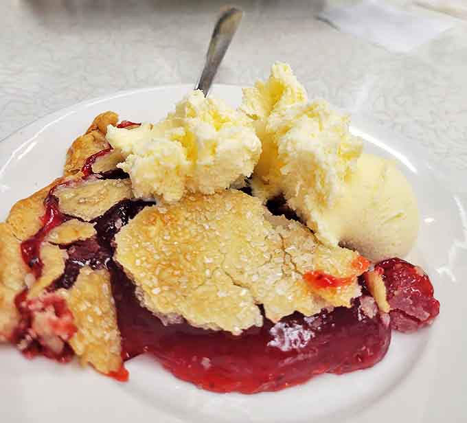 This isn't just dessert&mdash;it's a slice of Midwestern poetry. The warm raspberry filling and cool ice cream create a temperature tango that dances on your tongue.