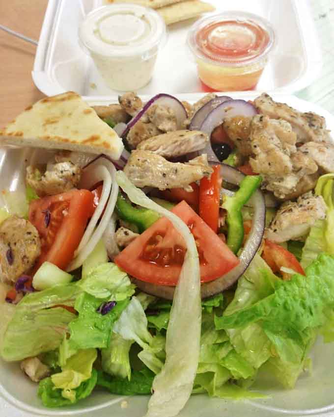 This chicken salad doesn't need fancy presentation to tell its story&mdash;fresh vegetables, seasoned protein, and dressings on the side mean business.