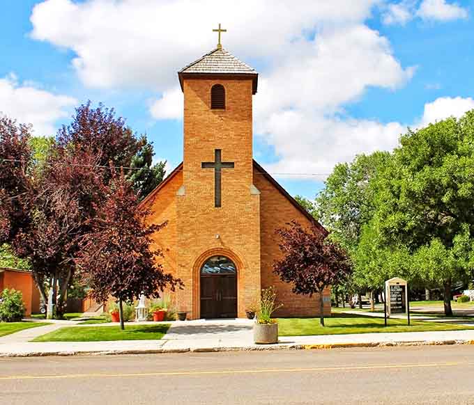 St. Joseph's Catholic Church stands as a brick testament to faith and community, its warm tones complementing the Montana sky like they were made for each other.