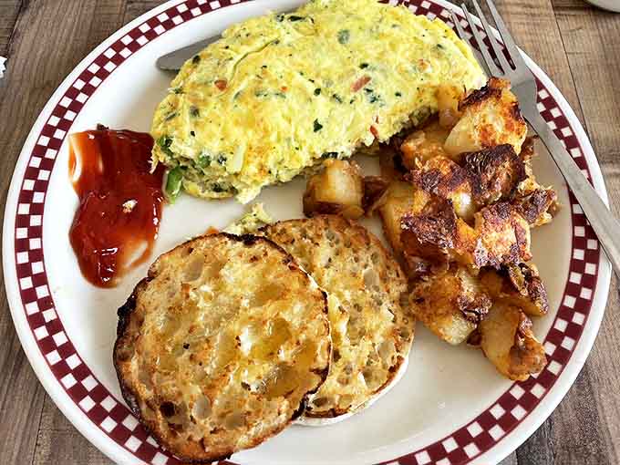 This isn't just an omelet&mdash;it's a vegetable garden wrapped in perfectly cooked eggs. The English muffin looks like it's applauding.
