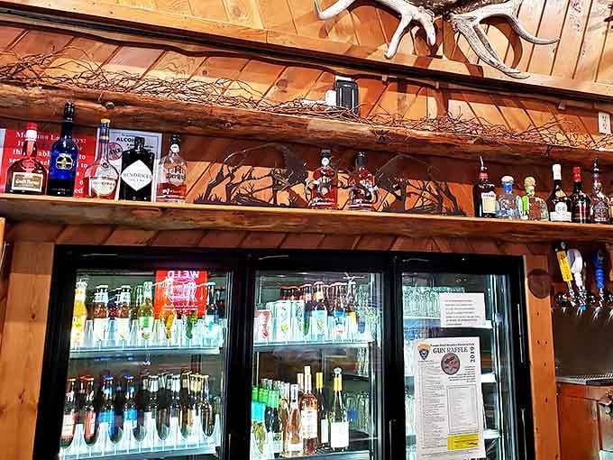 The bar area&mdash;where Montana's thirsty souls find salvation through bourbon and beer. Those antlers aren't just decoration; they're keeping watch over your drinking decisions.
