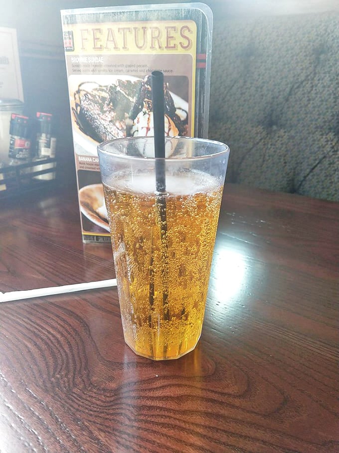 A perfectly poured amber beer catches the light, while dessert options lurk temptingly in the background&mdash;decisions, decisions.