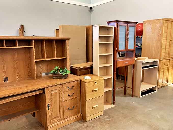 Solid wood furniture with character lines (some call them scratches) stands ready for new homes. These aren't just cabinets&mdash;they're future family heirlooms at thrift store prices.