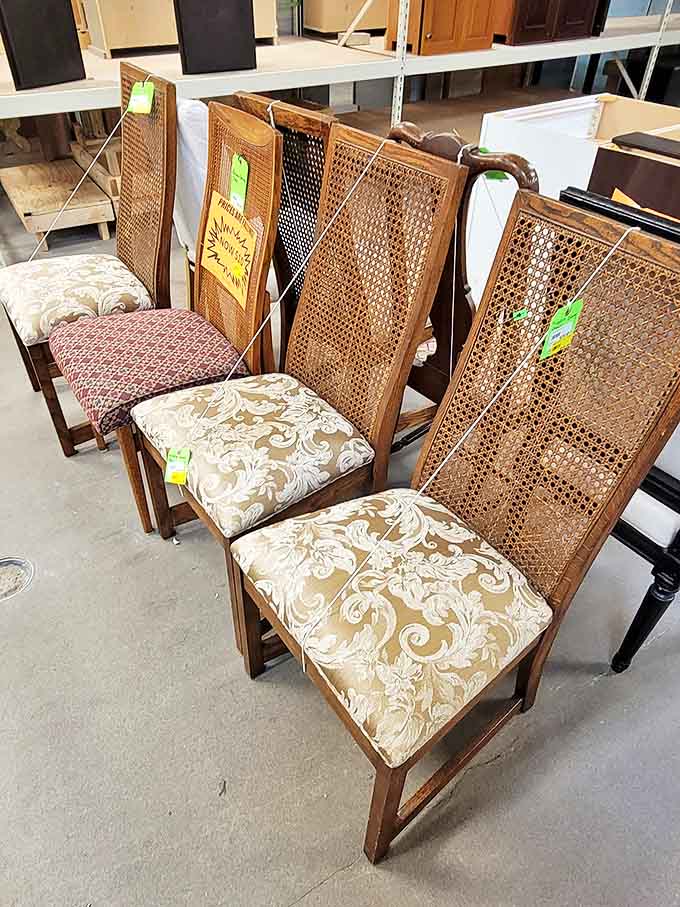 Chair-ish the moment! These cane-backed beauties with their damask cushions are waiting to elevate your dining room from "meh" to "magnificent" for pennies on the dollar.