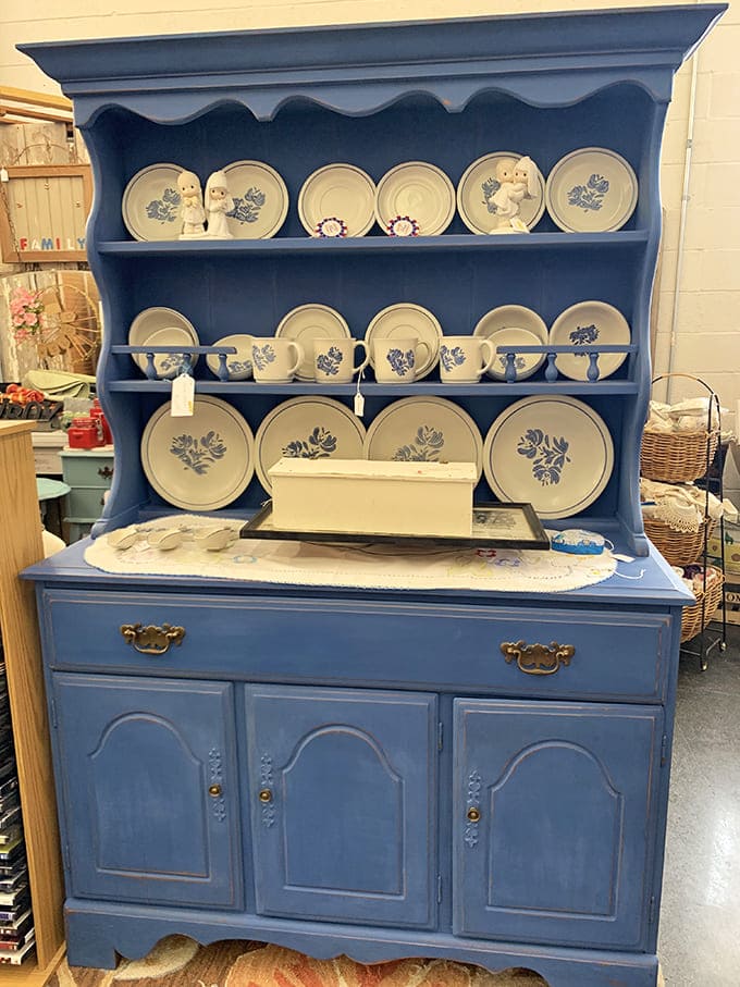 A blue hutch displaying matching china&mdash;the kind your grandmother would bring out only for holidays and special Sunday dinners.
