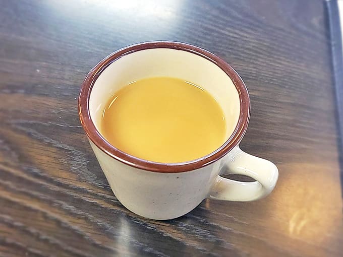 Coffee in a classic diner mug &ndash; where the warmth between your hands is as comforting as knowing refills are practically unlimited.