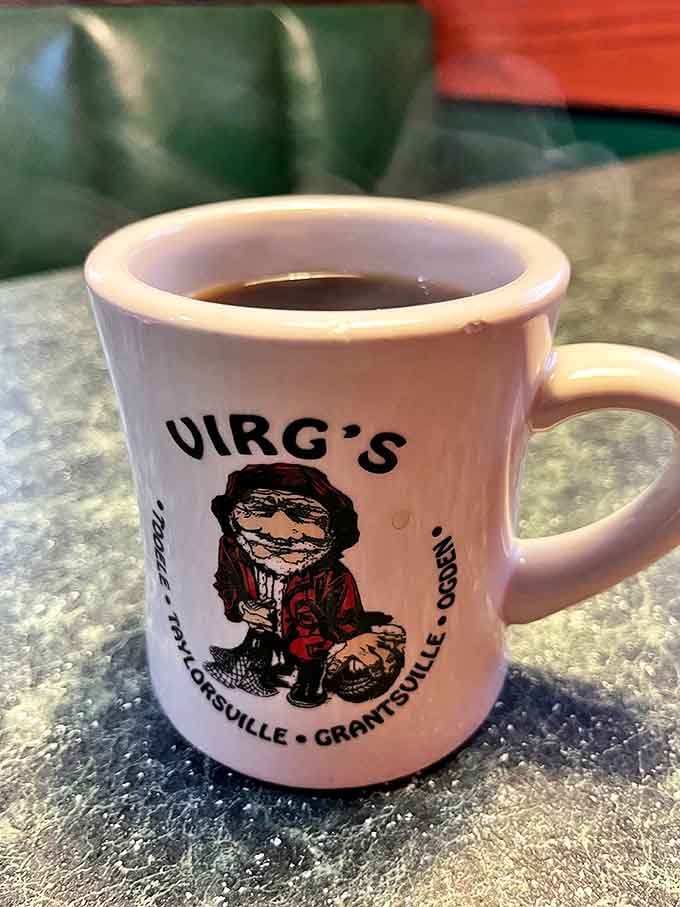 The humble diner mug—sturdy as a tank, filled with coffee dark enough to jump-start your heart, emblazoned with the Virg's logo like a badge of honor.