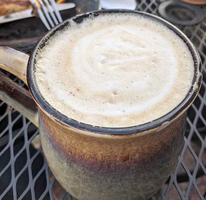 A ceramic mug cradles liquid comfort &ndash; the foam art may disappear with each sip, but the memory lingers much longer.