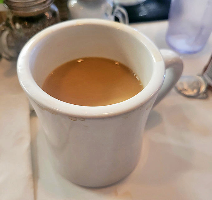 The humble diner coffee mug&mdash;holding what might be the most honest beverage in America. No foam art, just reliable warmth by the refill.