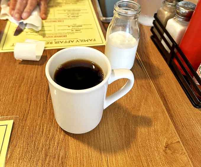 The humble coffee mug—unassuming yet mighty, like the best diners themselves. This isn't artisanal pour-over, it's something better: bottomless reliability.