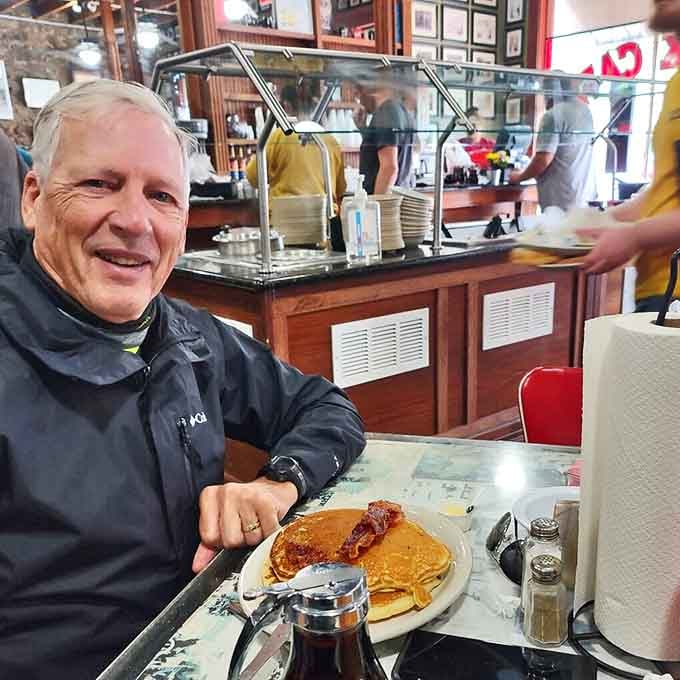 Some people come for the food, others for the pancakes that could double as frisbees. Either way, that mug of coffee promises to keep the conversation flowing.