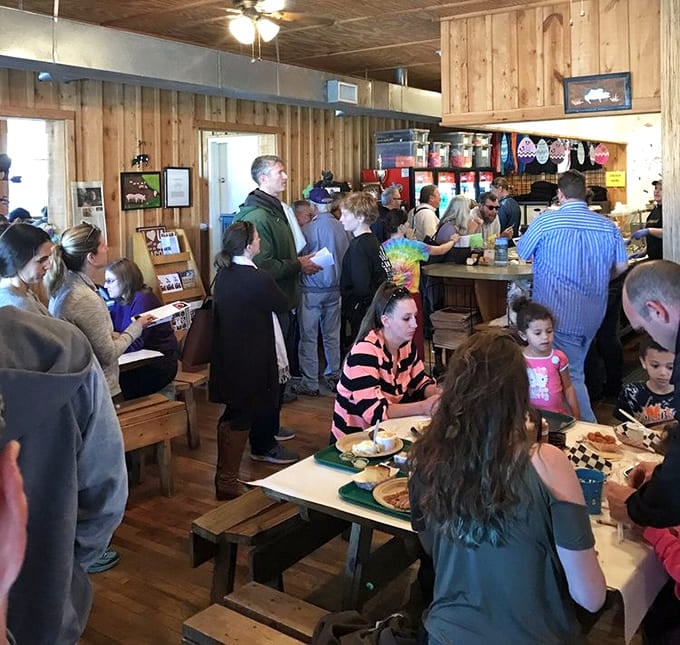 The universal language of barbecue brings together folks from all walks of life. Notice nobody's looking at their phones – the food demands attention.