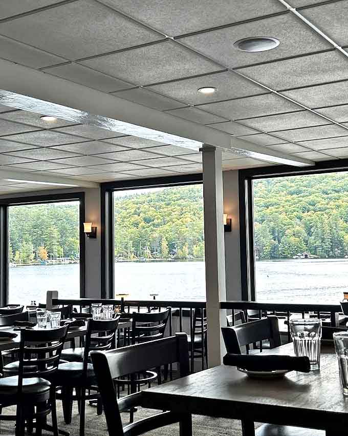 Those windows frame Squam Lake like a living painting, turning an ordinary meal into dinner and a show.