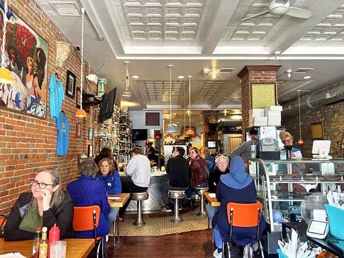 The bustling dining room where strangers become neighbors, united by the universal language of "pass the ketchup, please."