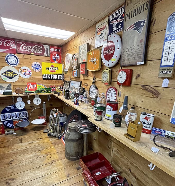 Vintage advertising heaven! Coca-Cola, Patriots, and gas station memorabilia create a shrine to American nostalgia that Don Draper would approve of.