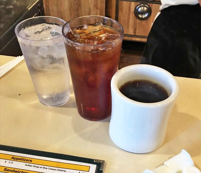 The diner trinity: water to hydrate, iced tea to refresh, and coffee that keeps flowing like conversation among old friends.