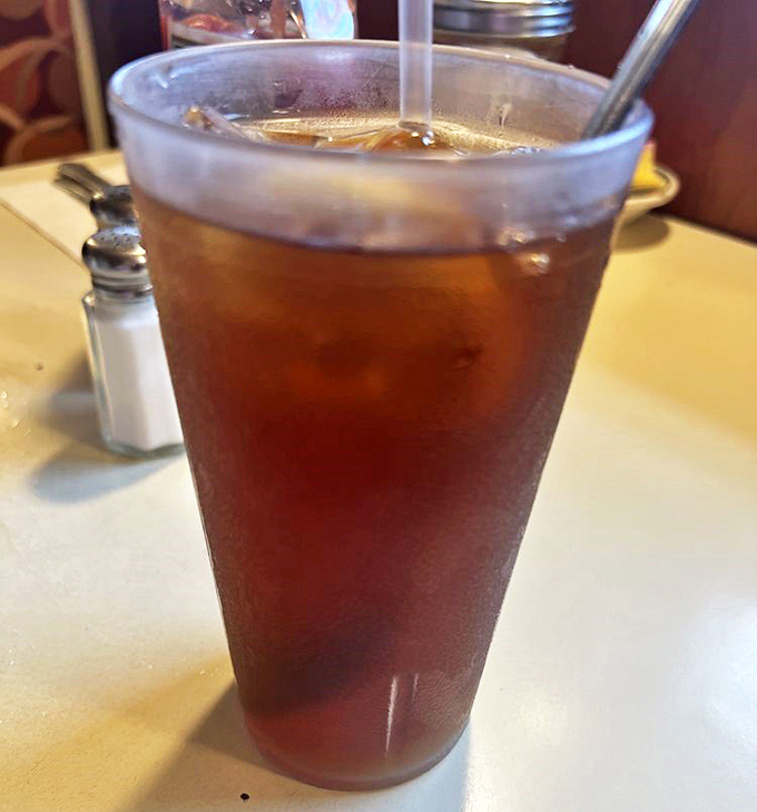 That iced tea isn't just refreshment&mdash;it's liquid therapy after a long day. Served in glasses tall enough to require their own elevator.