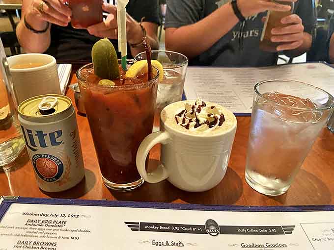 The Bloody Mary arrives with enough garnishes to count as a small appetizer. That Miller Lite chaser? Pure Wisconsin breakfast diplomacy at work.