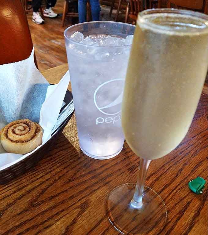 Even the drinks get special treatment here &ndash; that cinnamon roll waiting patiently beside what appears to be a celebratory champagne flute suggests this is no ordinary meal.