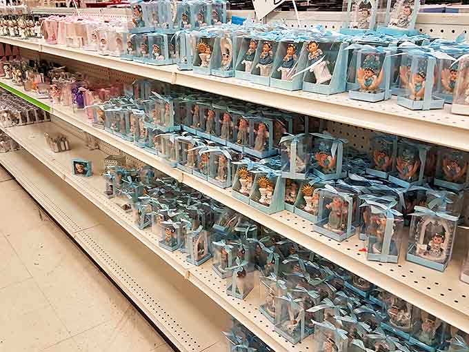 Baby figurines in blue packaging create an army of tiny celebrants, ready to adorn cakes or haunt your dreams, depending on your perspective.