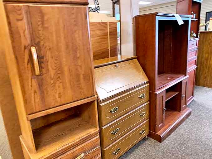 Solid wood furniture with stories to tell awaits new homes. That secretary desk has probably seen more letters than email.