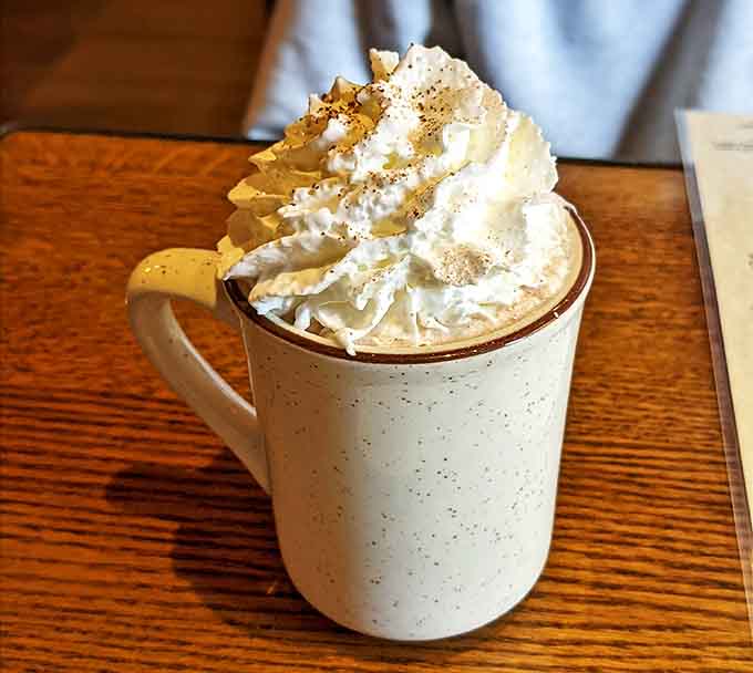 Whipped cream mountains rise from this hot chocolate mug &ndash; proof that Montana knows winter warmth comes in liquid form too.