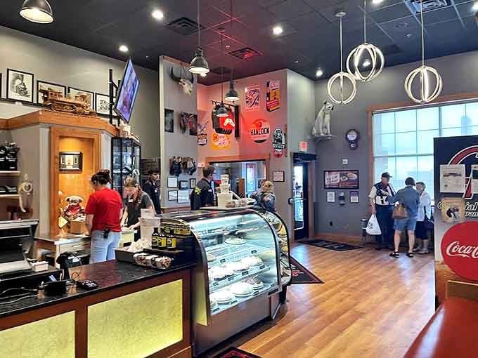 The bakery case and counter area buzz with activity, where dessert decisions are made and breakfast dreams come true.