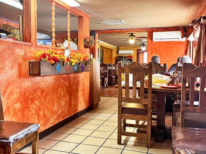 The warm terracotta walls and rustic wooden dividers aren't just d&eacute;cor&mdash;they're storytellers, whispering decades of family celebrations and everyday meals.