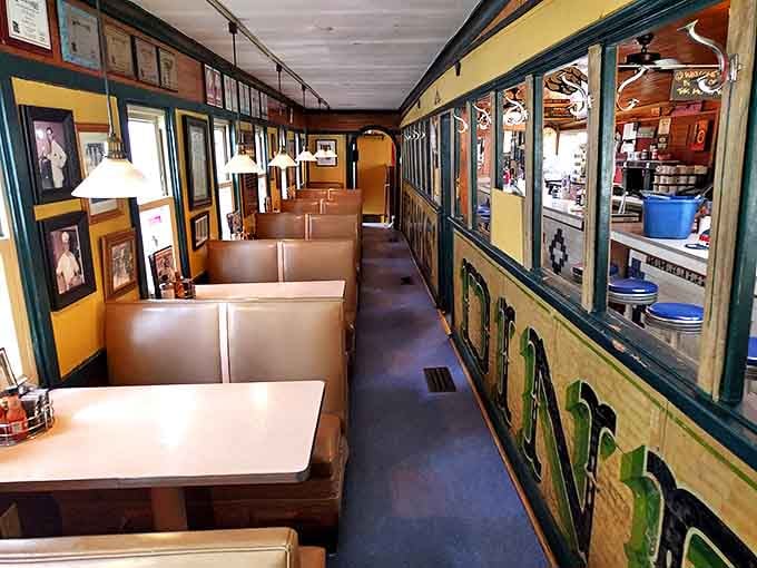 The booth section reveals Frank's railcar origins – narrow but somehow cozy, with decades of stories absorbed into those wooden walls.