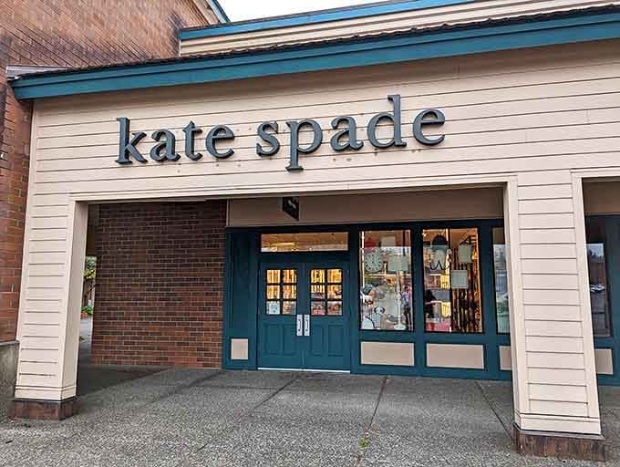 Kate Spade's teal doors might as well be portals to a world where practical accessories come in impractical but irresistible colors.