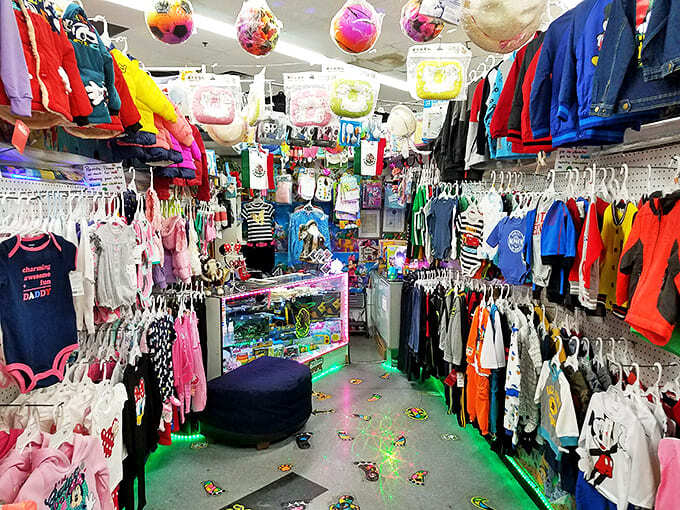 Childhood joy hangs from every rack in this kaleidoscopic kids' clothing corner. The floor's disco lighting adds unexpected pizzazz to tiny fashion decisions.
