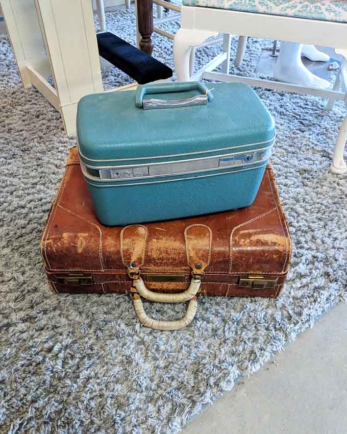 These vintage suitcases have stories to tell. The turquoise beauty on top looks like it once accompanied Jackie O to Capri.