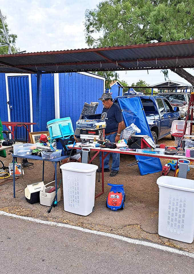 A seasoned vendor tends his eclectic collection, ready to share stories behind every mysterious item displayed.
