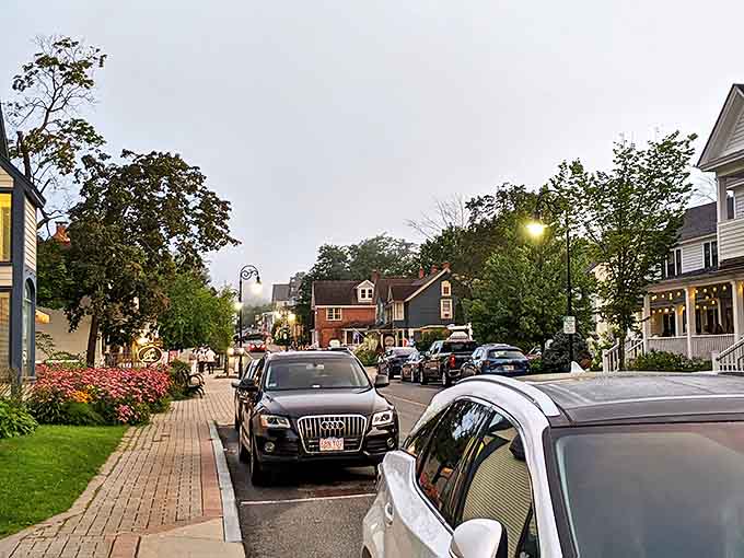 Evening settles on Lenox's charming streets, where lamp posts glow like fireflies and dinner reservations await.