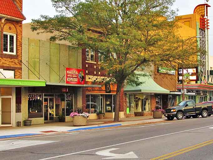 Scottsbluff's tree-lined main street offers shade for window shoppers discovering affordable treasures in this western Nebraska gem.