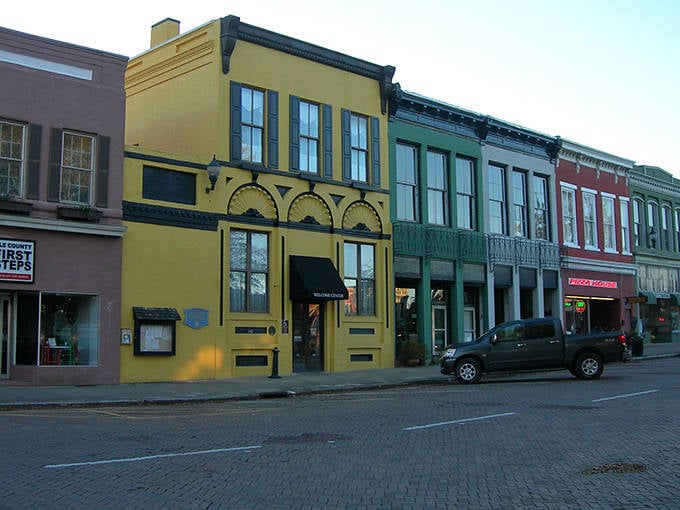 Abbeville's colorful historic buildings line the brick streets, creating the perfect backdrop for a small-town romance story.
