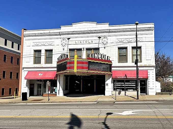 Stroll past the iconic Lincoln Theatre in Massillon, where historic architecture and vibrant red awnings brighten your day in Ohio.
