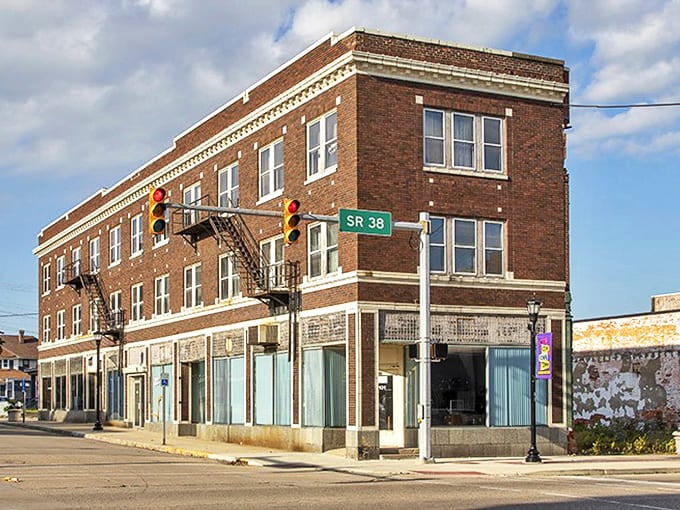 New Castle's huge brick building watches over streets where living costs run 50% below national averages, a building with good news!