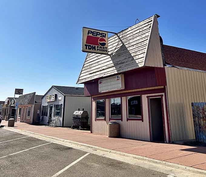 That distinctive Pepsi sign marks more than just a place to eat—it's where New Town residents catch up on local news.