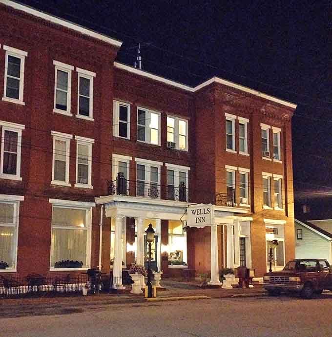 The Wells Inn glows with old-world charm after dark &ndash; a brick sentinel watching over Sistersville's peaceful streets.