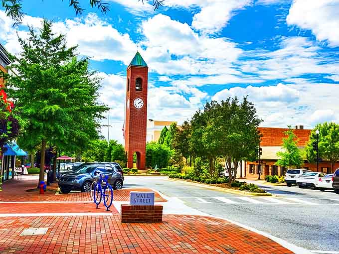 Spartanburg's iconic clock tower stands tall over brick-paved Wall Street, where small-town charm meets affordable city living.