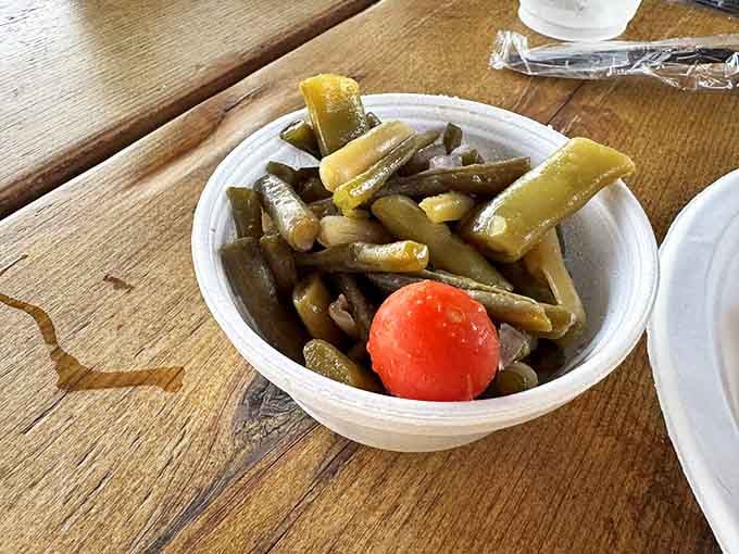 These aren't your average green beans&mdash;they're pickled with just enough tang to cut through the richness of fried seafood, with a cherry tomato for good measure.