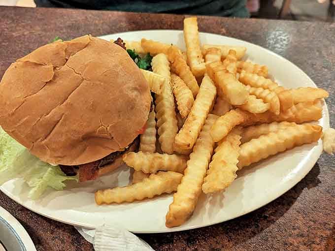 A burger that requires both hands and a stack of napkins &ndash; the universal sign of good things happening in the kitchen.