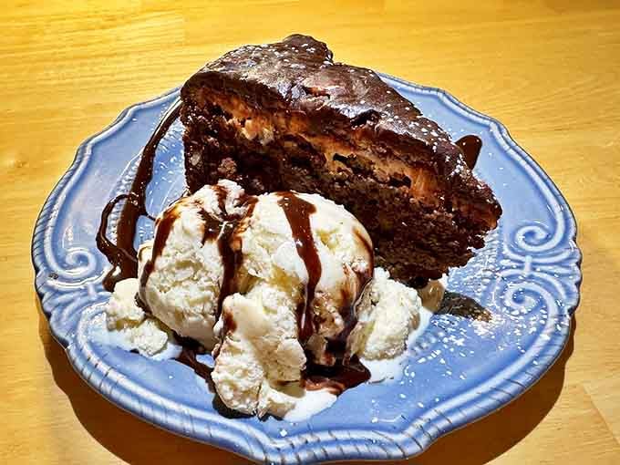 Chocolate cake with ice cream: where your diet goes to die a glorious, delicious death. That blue plate makes the whole dessert look like edible art.