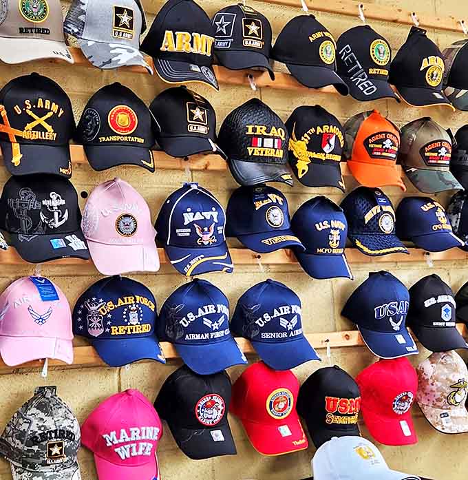 Military caps that have seen more peaceful duty than active service, displayed with pride and ready to crown patriotic shoppers.