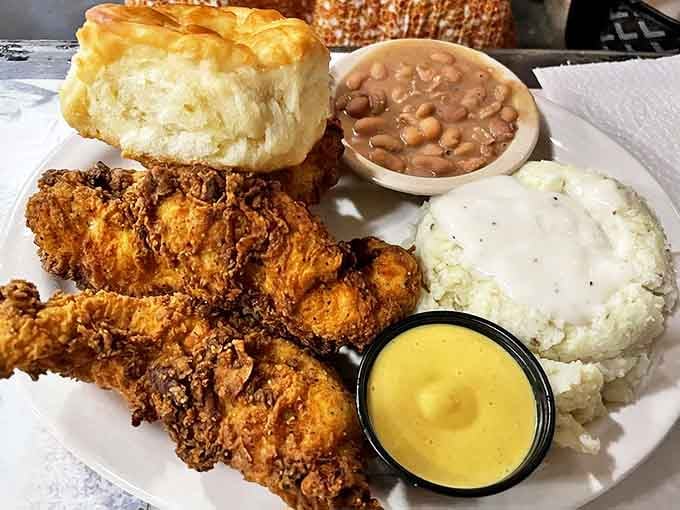 Fried chicken that would make your grandmother both proud and jealous. The biscuit stands tall, the beans simmer with promise, and the potatoes await their gravy bath.