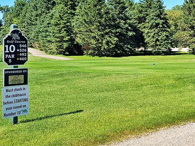At Cross Roads Golf Club, the perfectly manicured 10th hole invites duffers and pros alike to test their skills against North Dakota's endless blue skies.