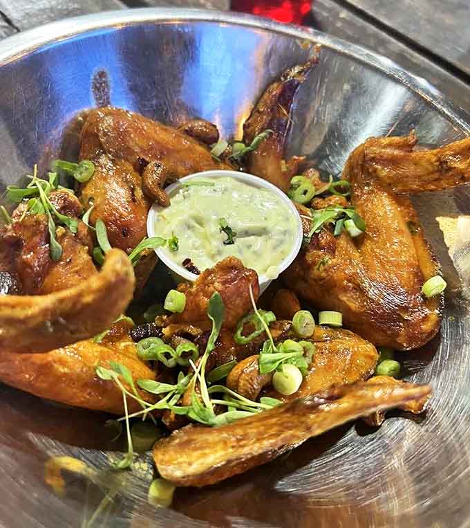 These aren't just wings; they're flavor vehicles with a perfect crisp-to-juicy ratio and a dipping sauce worth bottling and taking home.