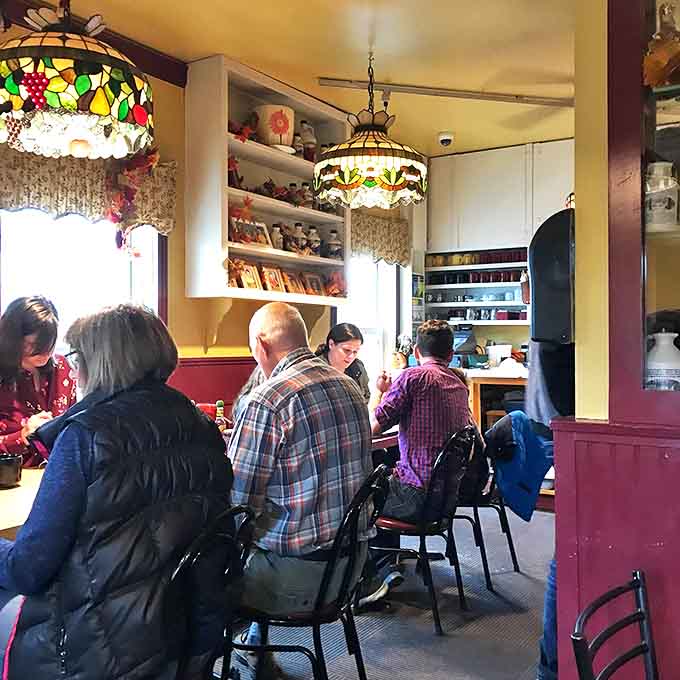 The true measure of a great breakfast spot: happy diners huddled around tables, completely ignoring their phones in favor of food and conversation.