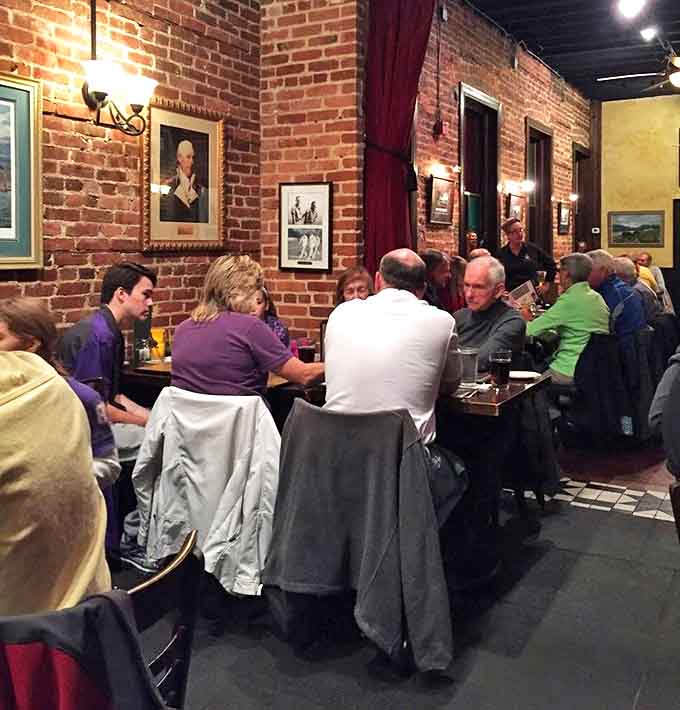 The true test of any pub: locals gathered at wooden tables, solving the world's problems one pint at a time.